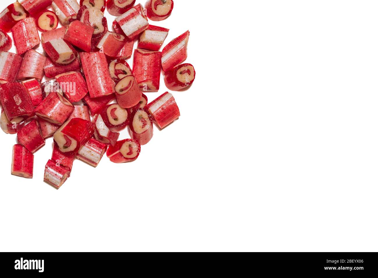 Big handful of red chilli lollipops with the image of pepper. Top view ...