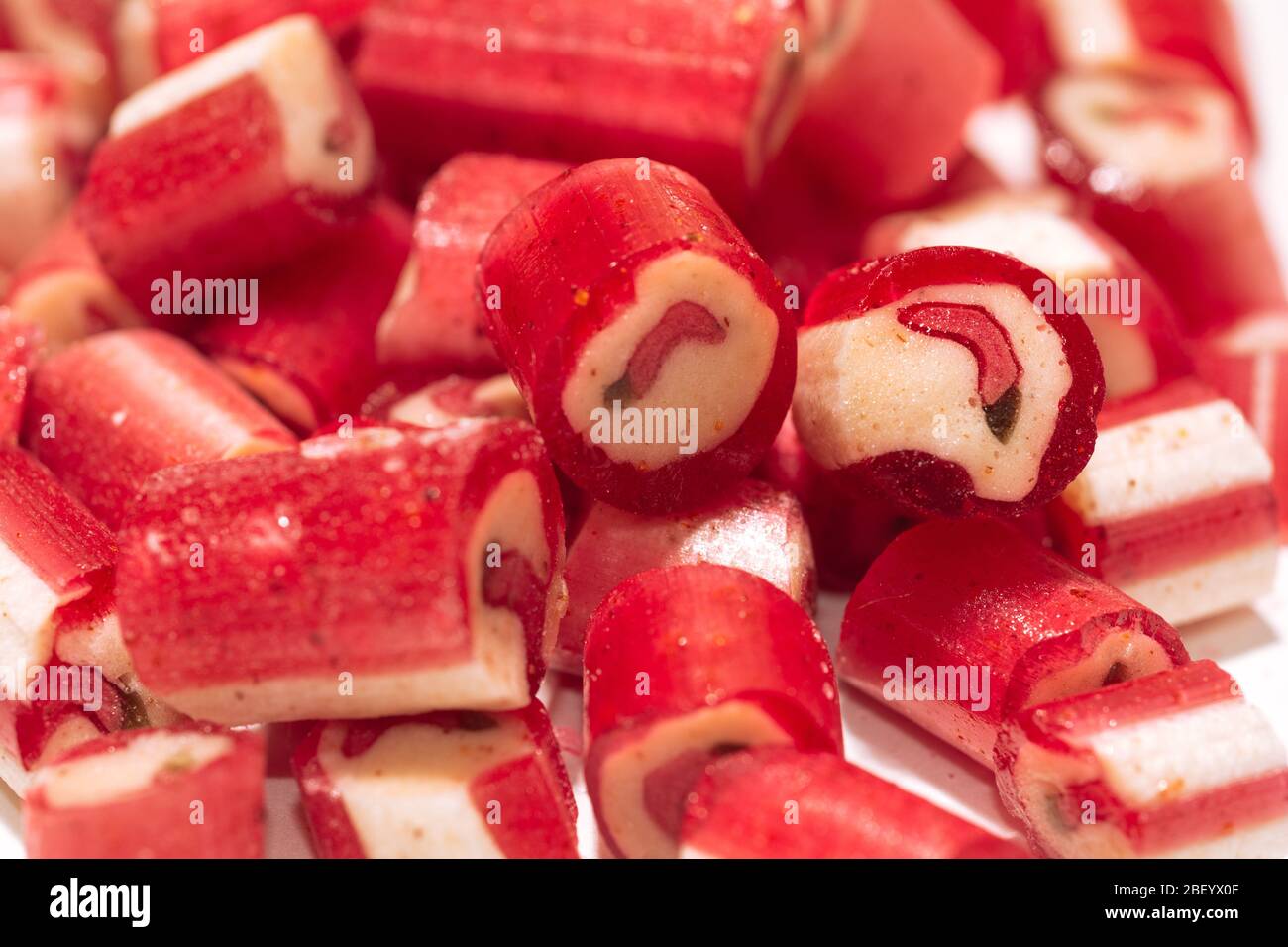Big handful of red chilli lollipops with the image of pepper isolated ...