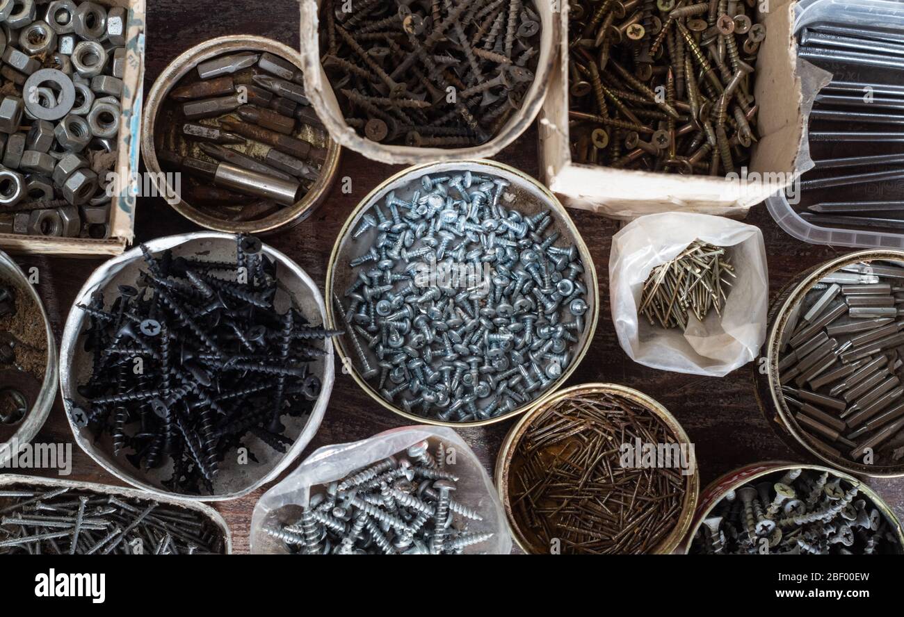 Various hardware, nails, screws and bolts in boxes. Home workshop. Top ...