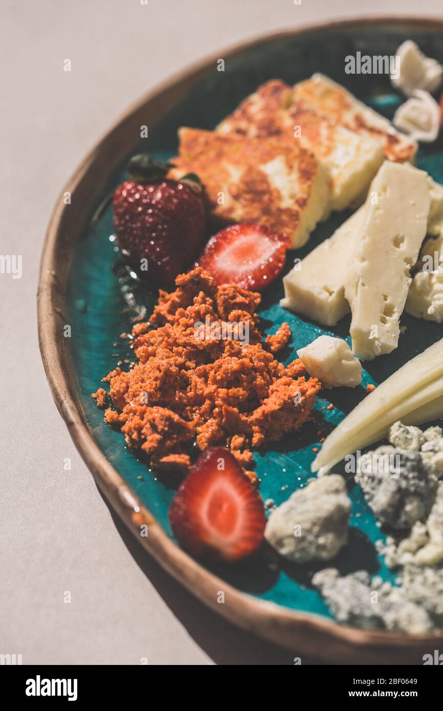 Vertical image of the Mediterranean cheese platter with variety of ...