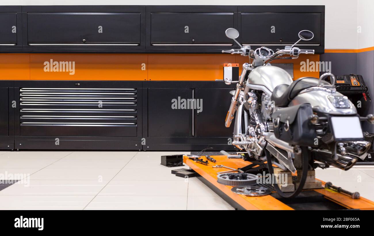 Photo of a motorcycle service garage. Workshop. Disassembled motorcycle ...