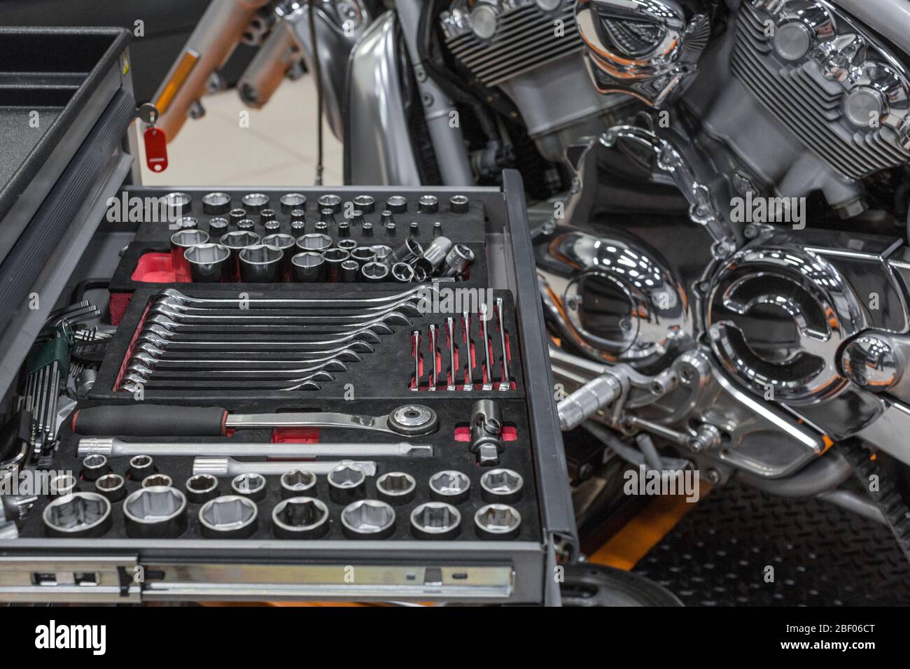 Side view of a pull-out selves in a motorcicle service workshop ...