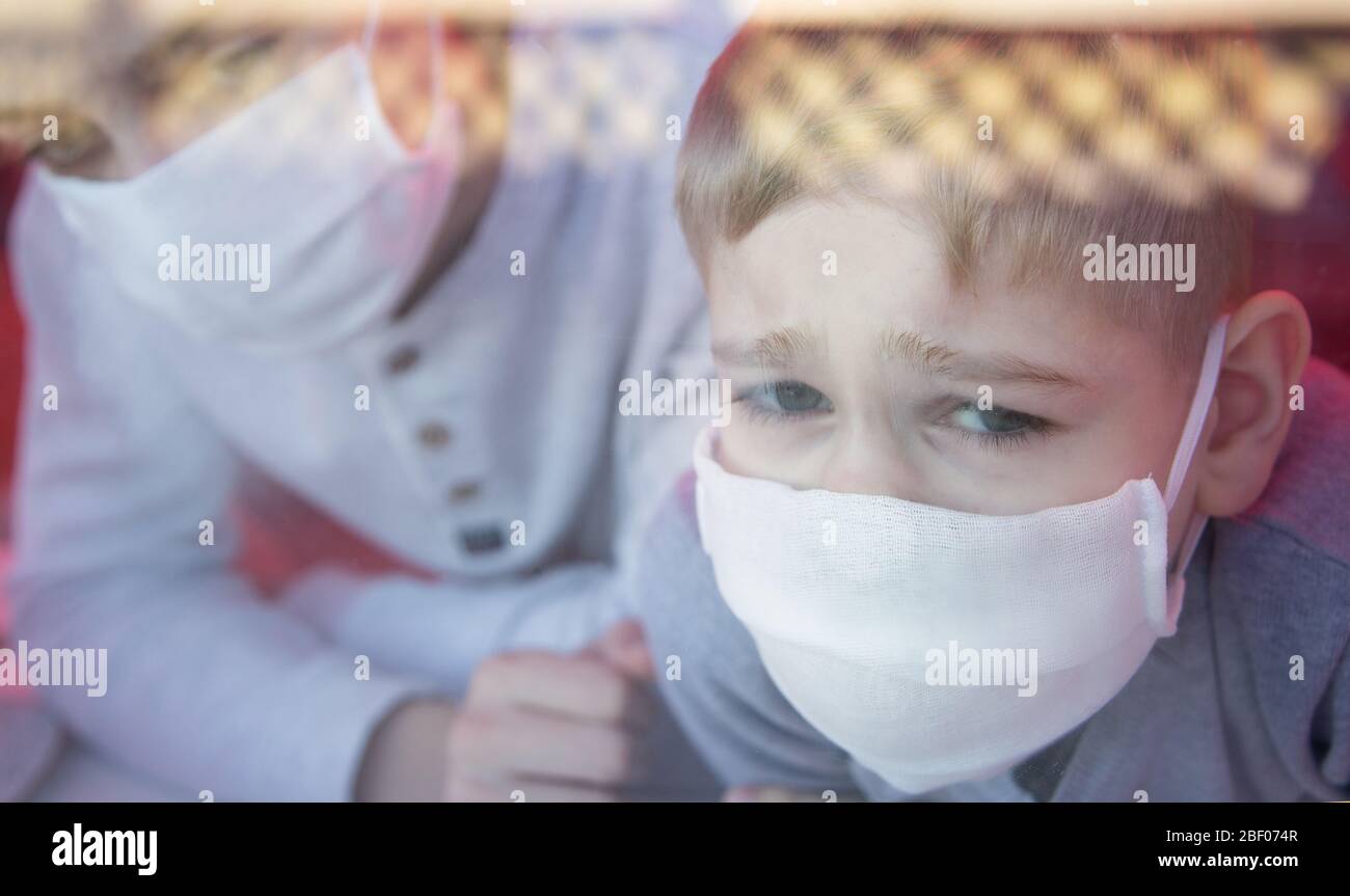 Sad boy in protective medical hi-res stock photography and images - Alamy