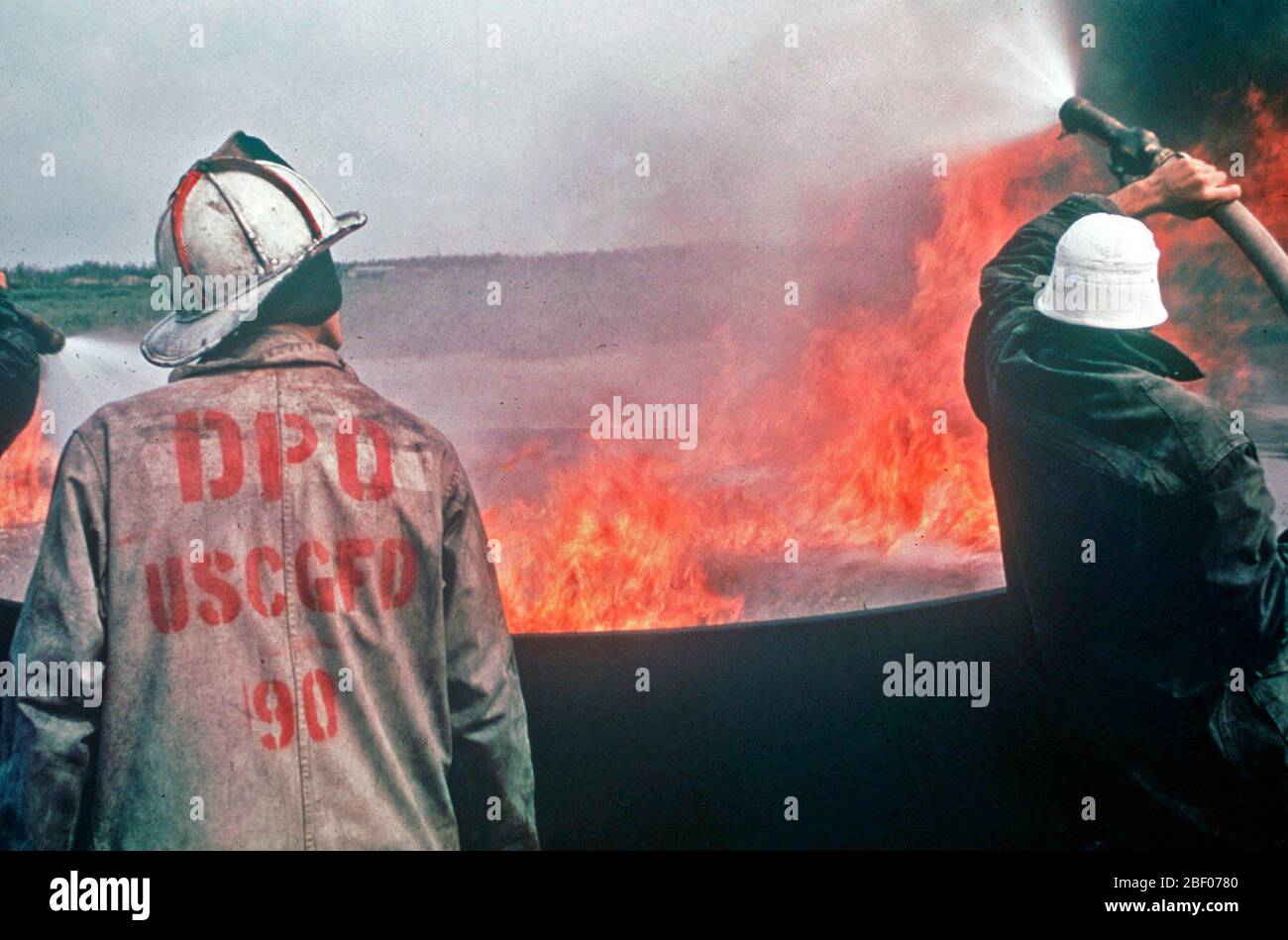 (Apr. 8)--The Coast Guard works to put out a fire from oil that was ...