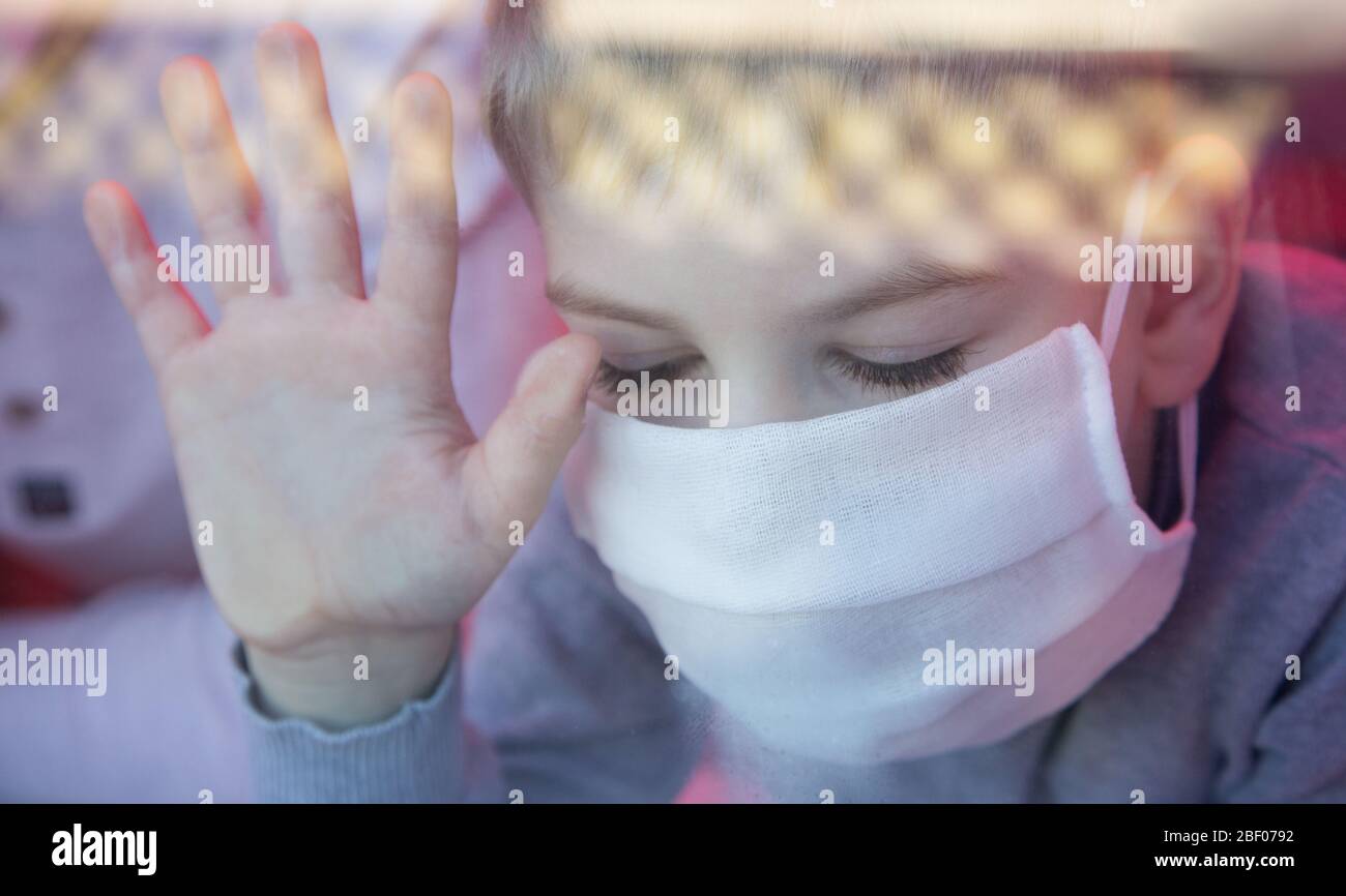 Sad boy in protective medical hi-res stock photography and images - Alamy