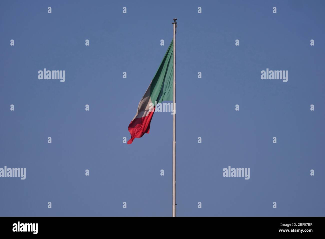Italian flag exposed to the windows Stock Photo - Alamy
