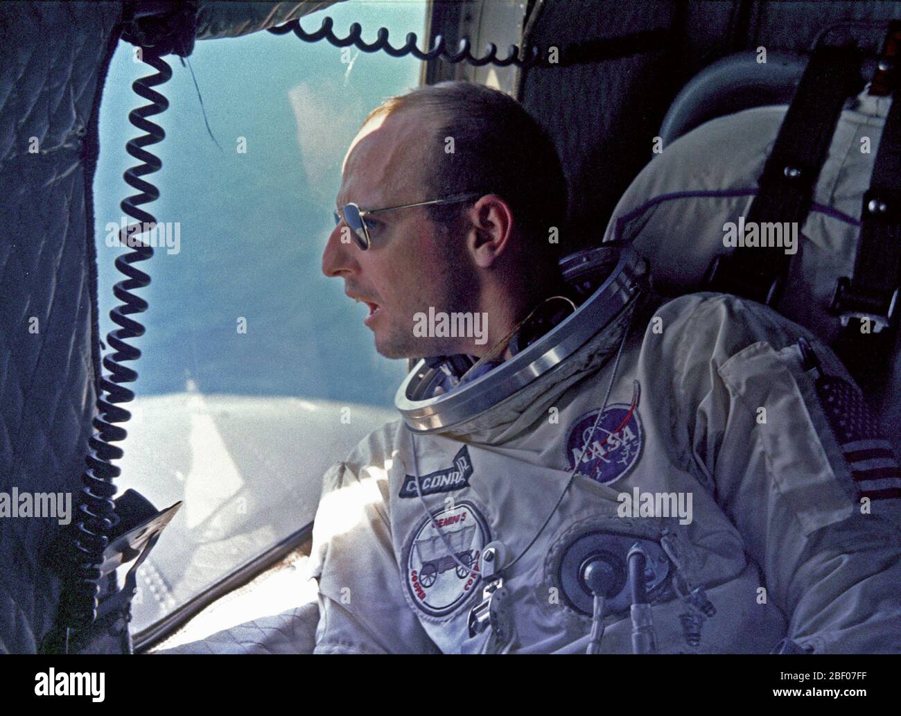 Charles "Pete" Conrad Jr. looks out of the helicopter window after ...