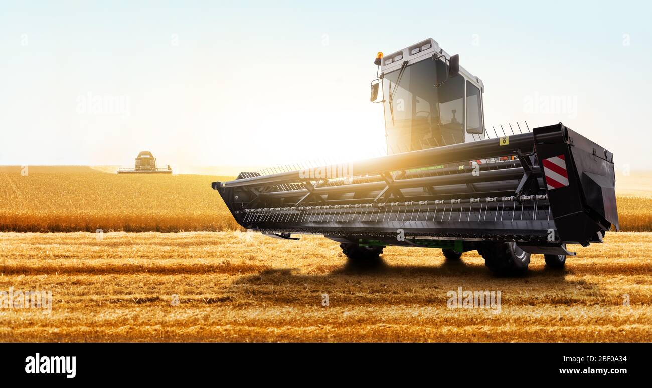 Harvesting combine harvester harvesting wheat hi-res stock photography ...