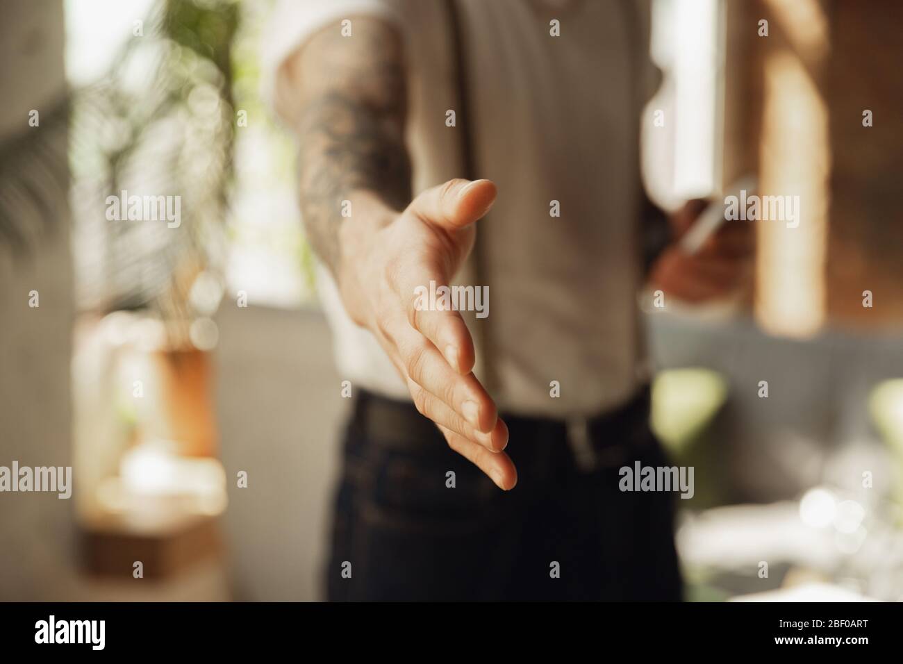 Close up of male hand greeting, welcoming somebody. Education ...