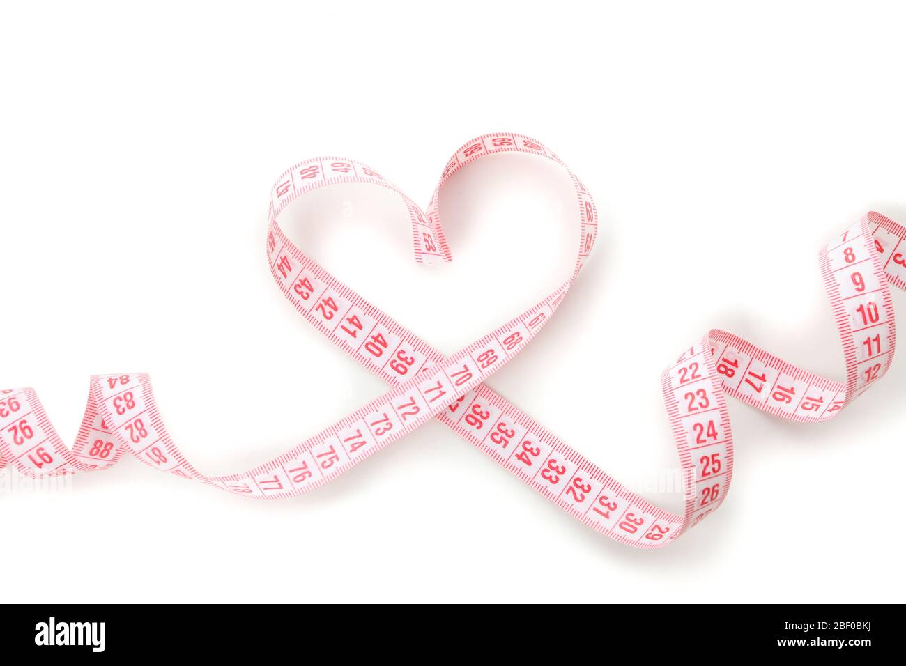 Measuring tape in the form of heart isolated on white background Stock ...