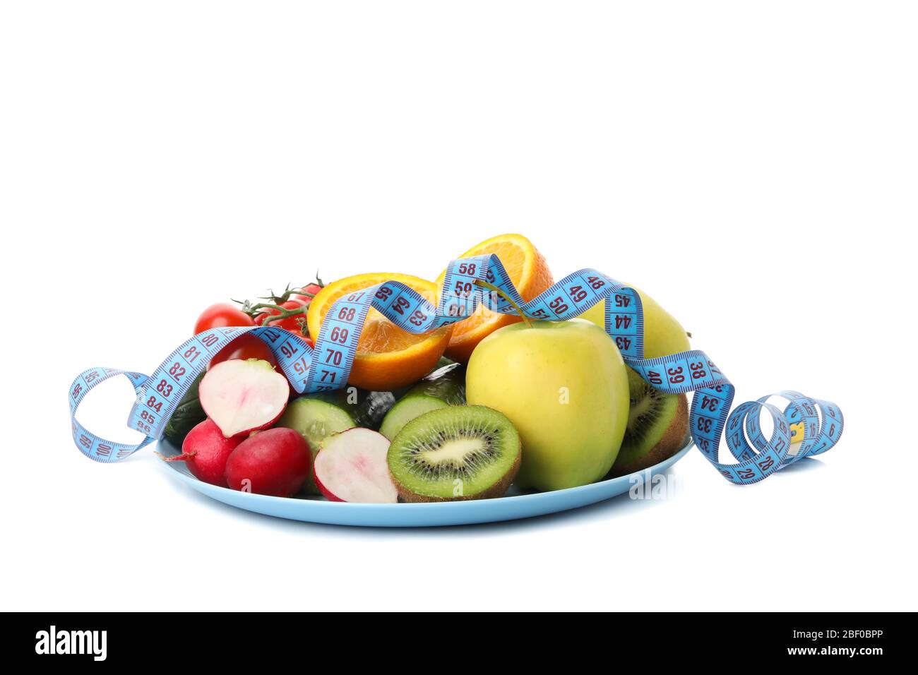 Plate with measuring tape and vegetarian food isolated on white ...