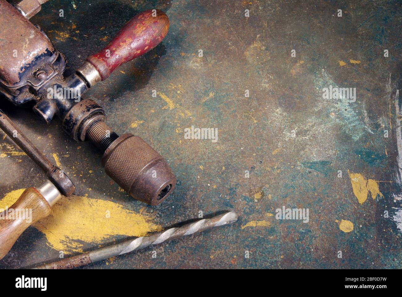 Dirty and stained work table with old rusty tools and space for text ...