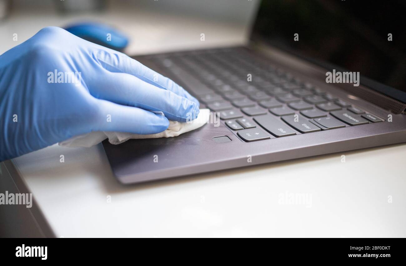 office sanitizing wipe wiping laptop keyboard with disinfecting wipes ...