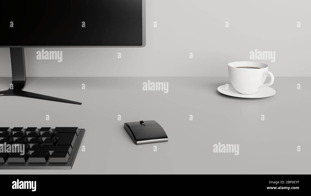 Desktop detail with a computer screen, keyboard, mouse and a cup of ...