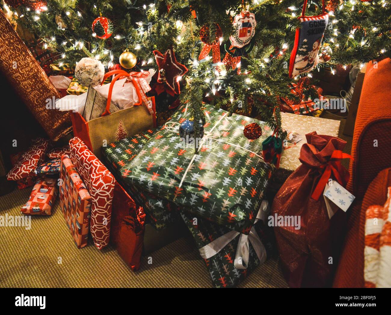 Christmas Presents under a tree Stock Photo - Alamy