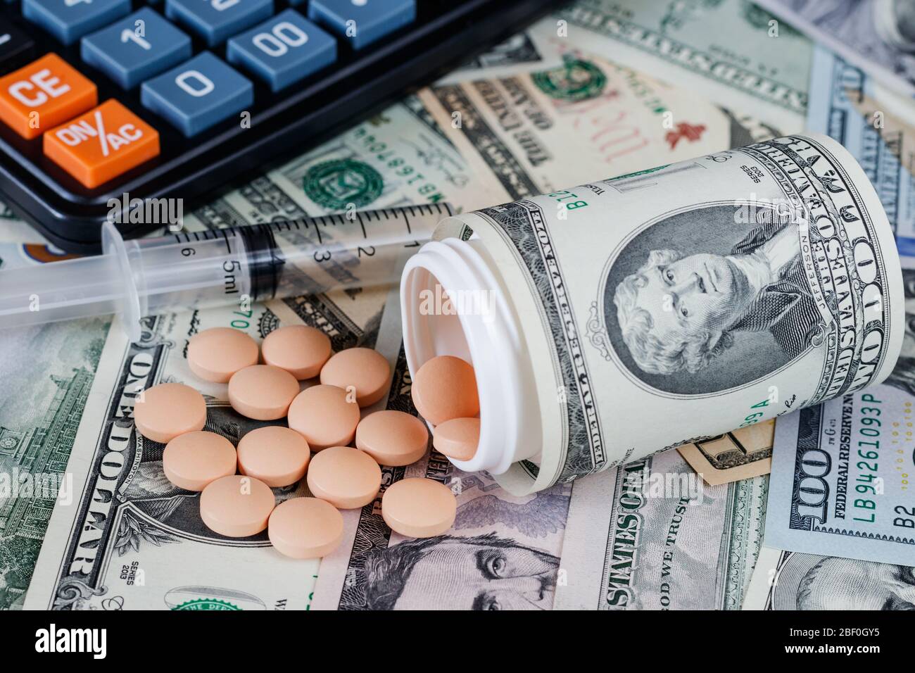 Medicine pills and black calculator with dollars. Pharmacy prescription ...