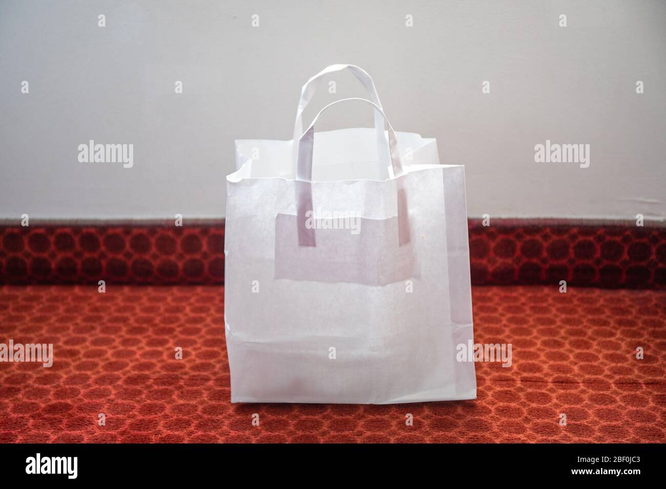 Big White Paper Shopping Bag at Floor Stock Photo - Alamy Big White Paper Shopping Bag at Floor Stock Photo - Alamy