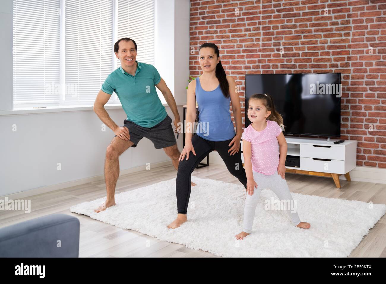 Fit Family Doing Home Online Stretching Yoga Fitness Exercise Stock ...