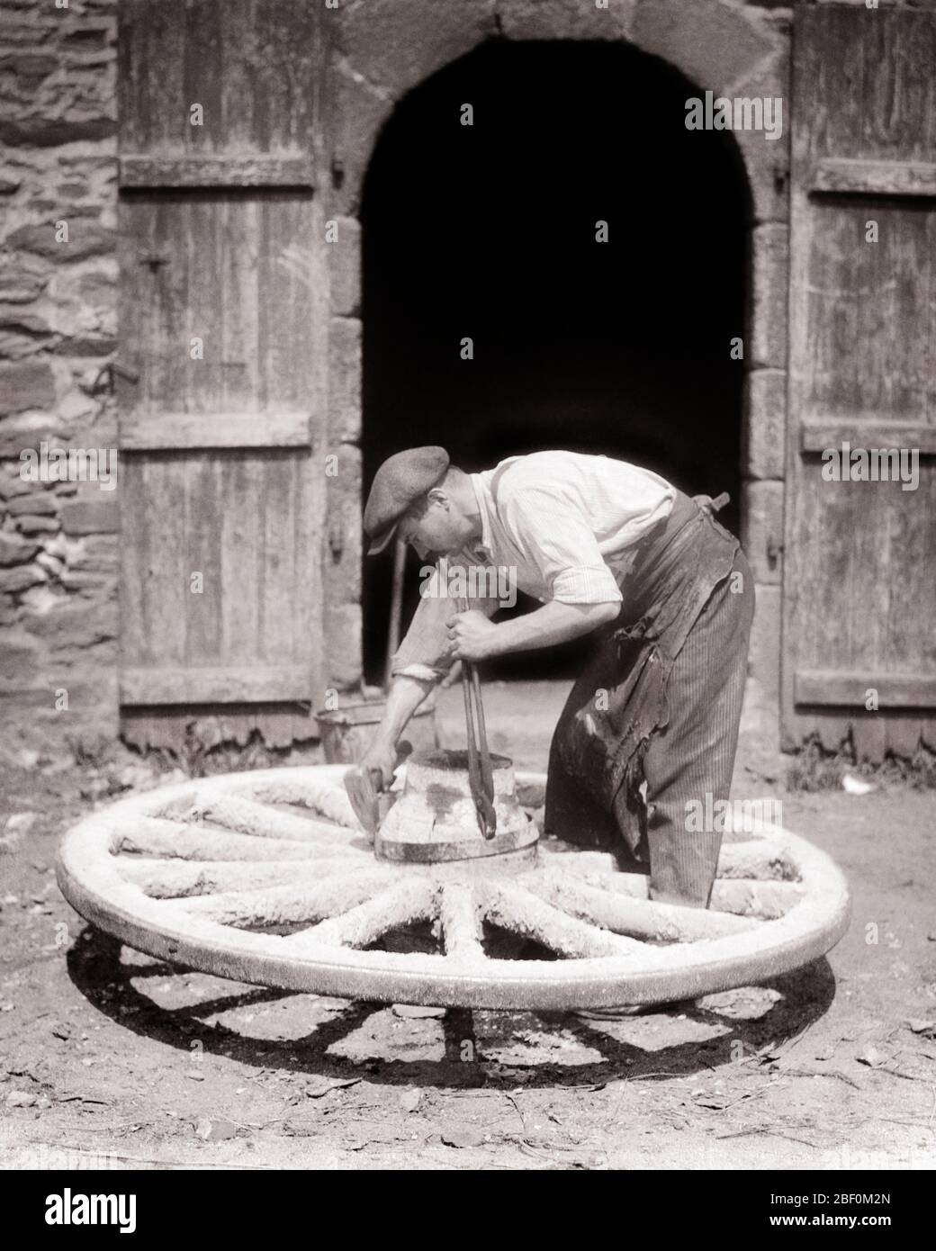 Old wooden wheel with iron fitting hi-res stock photography and images ...