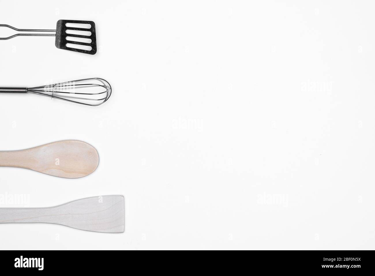 Stainless steel kitchen utensils isolated on white background. For copy ...