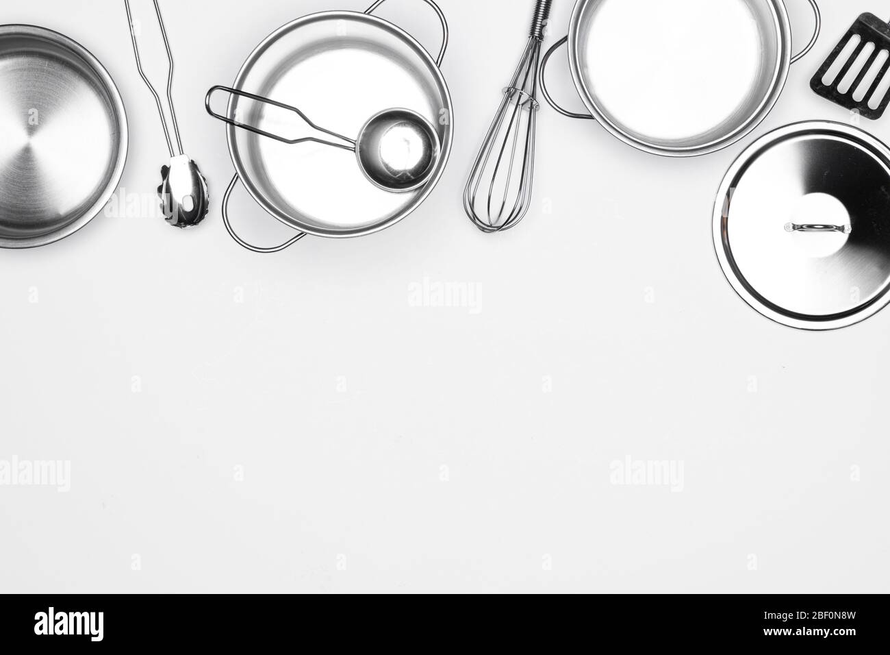 Stainless steel kitchen utensils isolated on white background. For copy ...