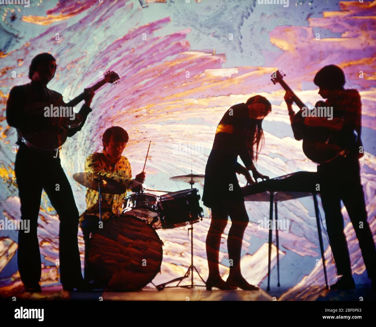 1960s 1970s ANONYMOUS SILHOUETTED TEEN ROCK BAND GIRL ON KEYBOARD WITH