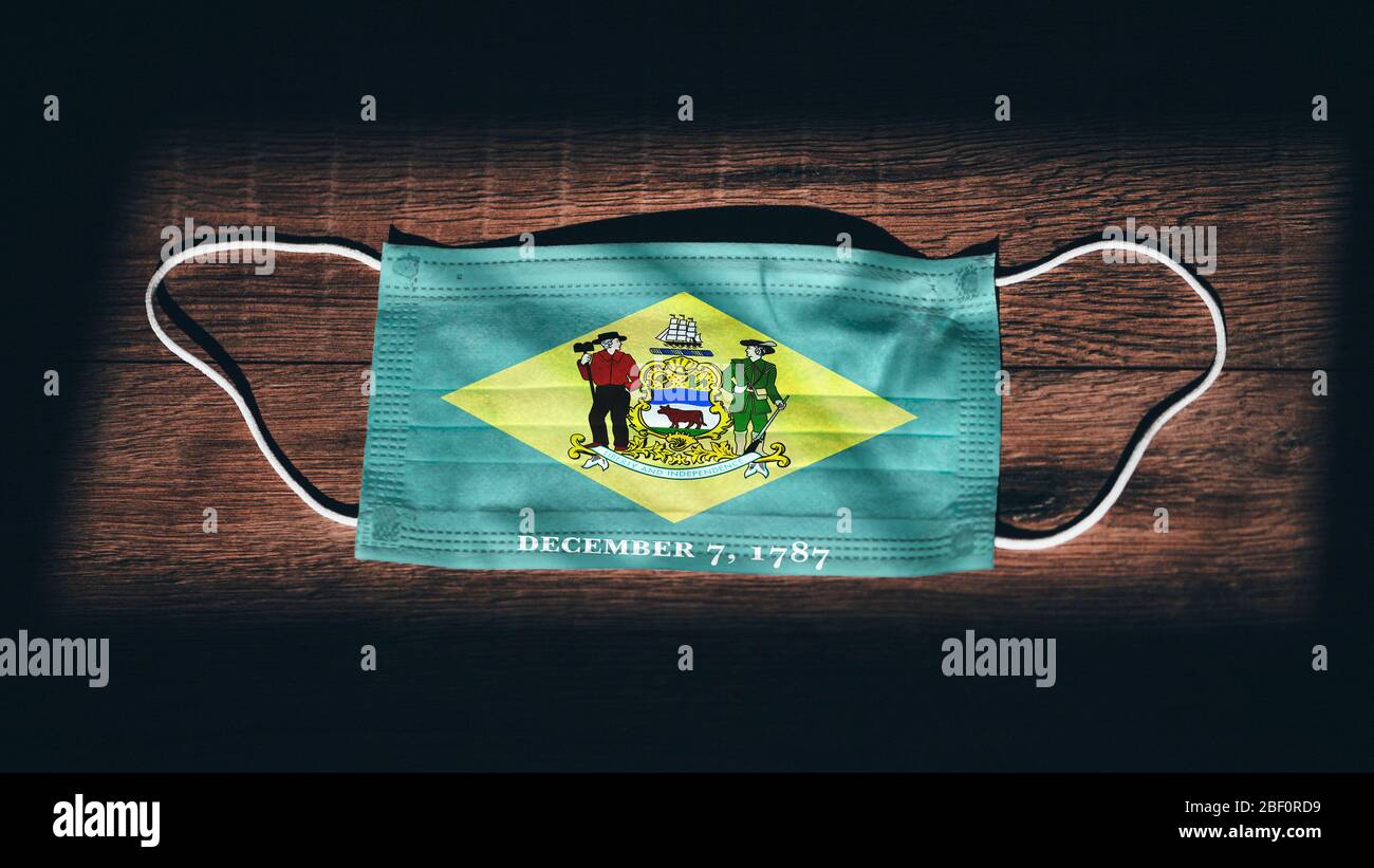 Delaware Flag. Coronavirus Covid 19 in U.S. State. Medical mask isolate ...
