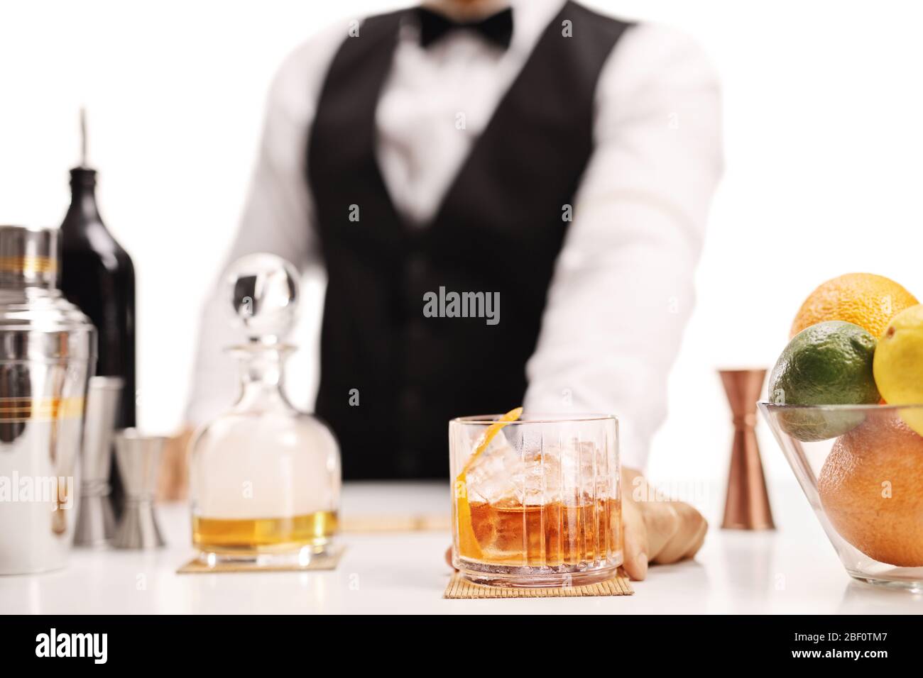 Barman serving whiskey on the rocks isolated on white background Stock ...