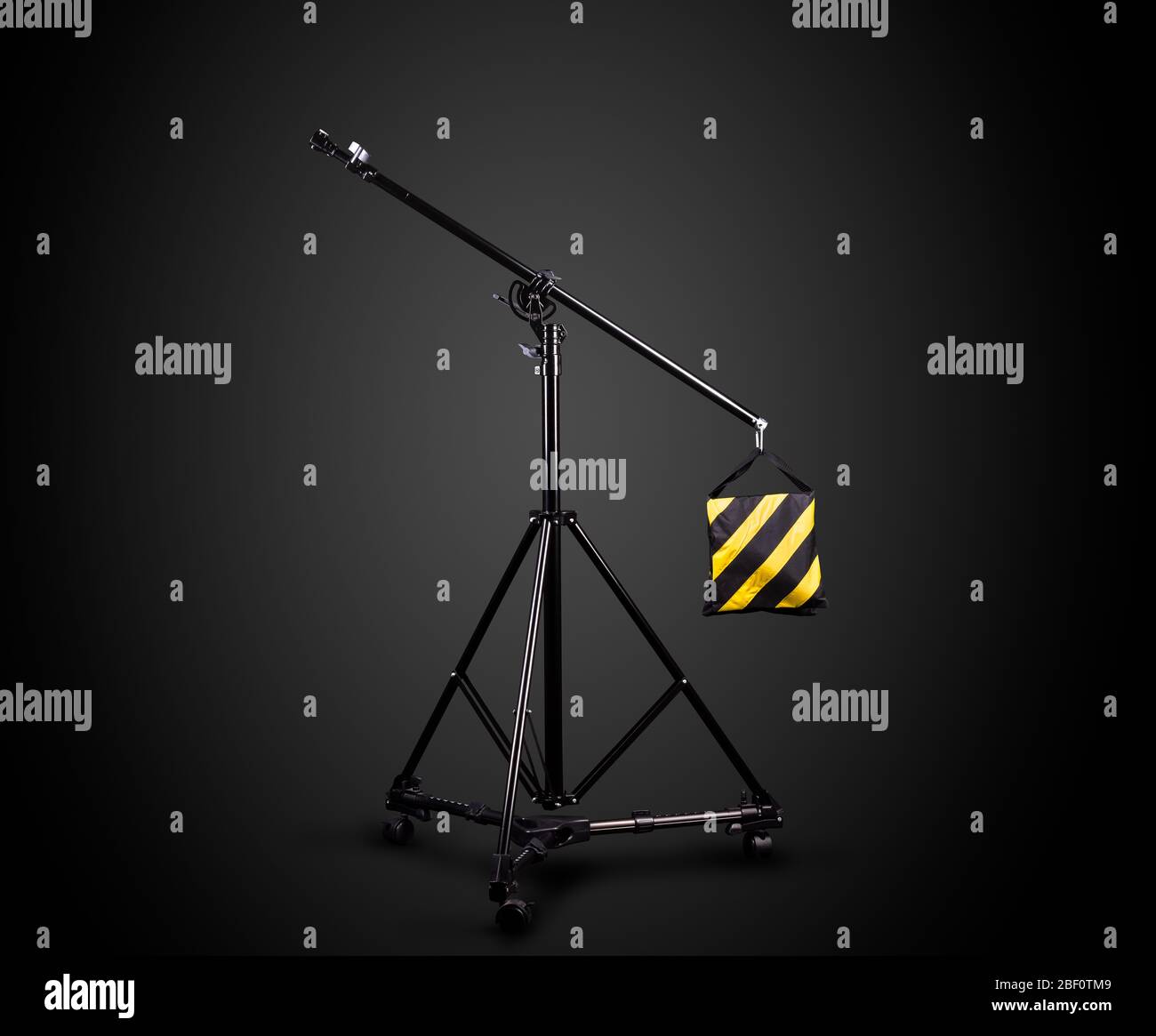Photo studio lighting stands isolated on the black background Stock ...