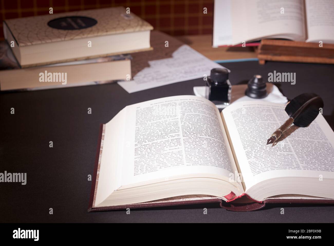 Old books, pen and ink on the table Stock Photo - Alamy