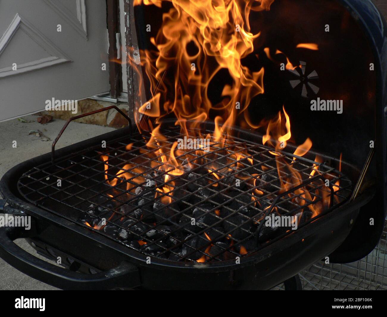 Fire in Cooking Grill Stock Photo - Alamy