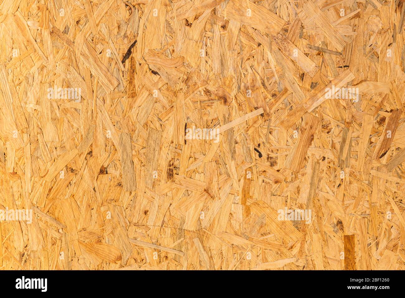 Pressed wooden panel background, seamless texture of oriented strand ...