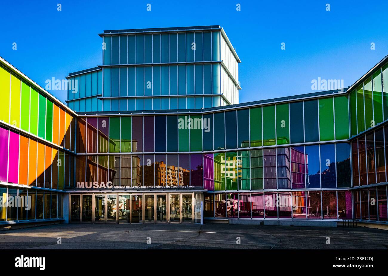 MUSAC entrance with surrounding buildings reflecting in its walls ...