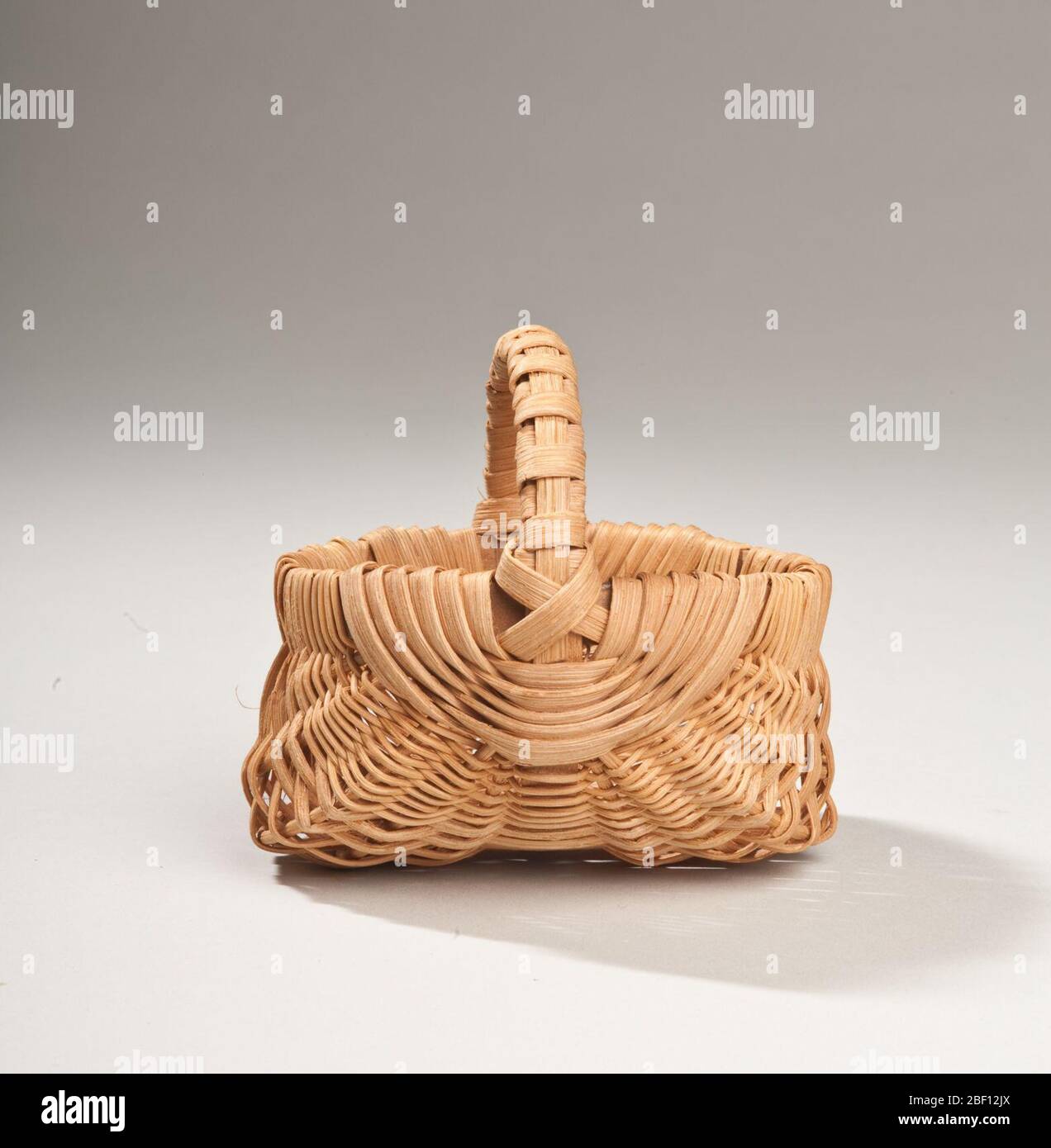 Small Handmade Basket with Handle Stock Photo - Alamy