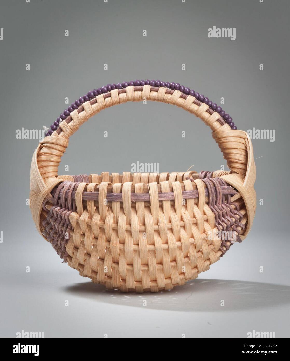 Handmade Basket with Purple Design and Handle Stock Photo - Alamy
