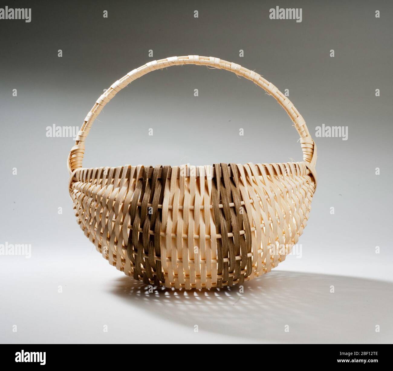 Handmade Basket with Handle and Vertical Designs Stock Photo - Alamy