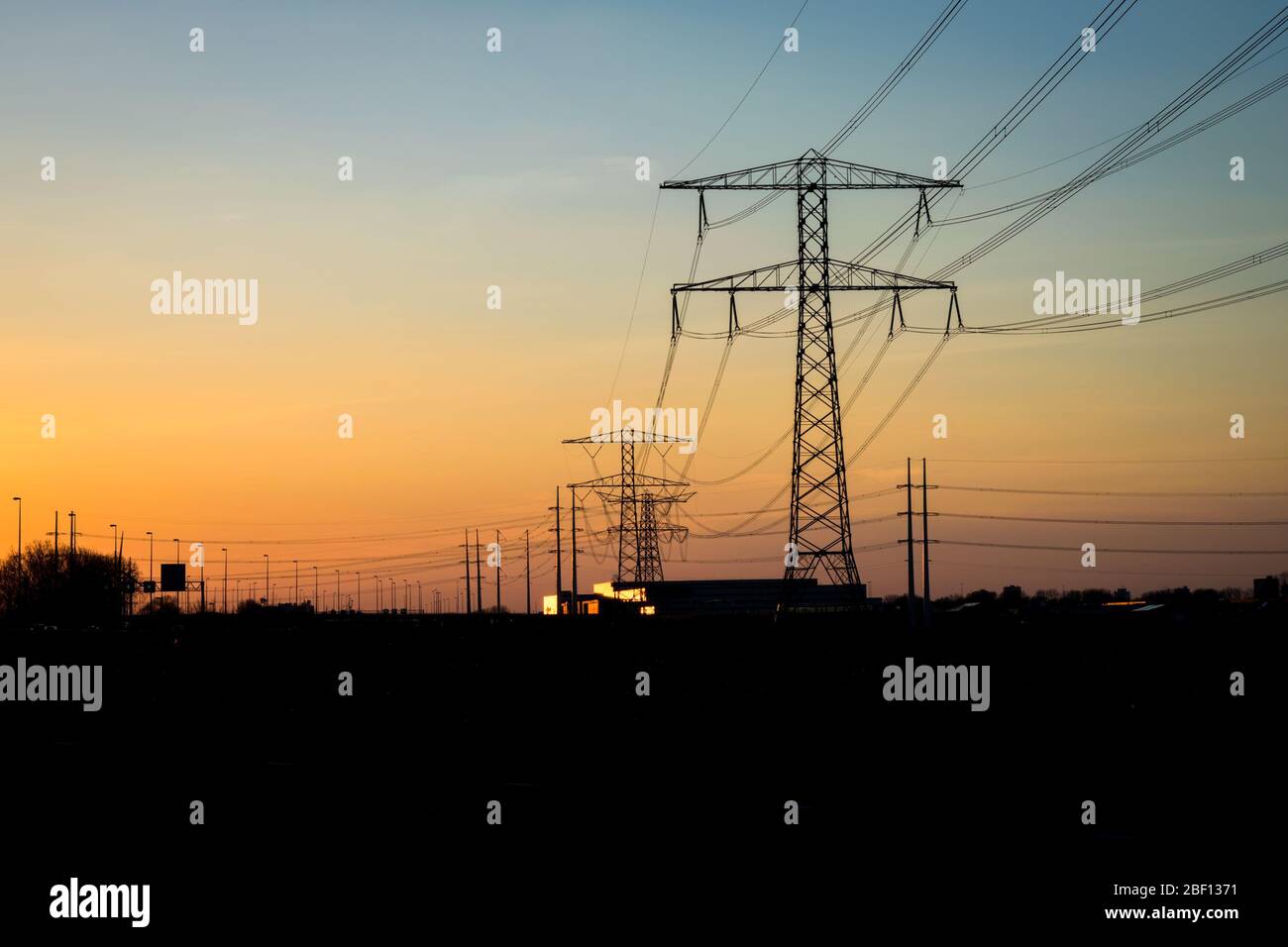 High-voltage pylons with power lines for the transport of electricity ...