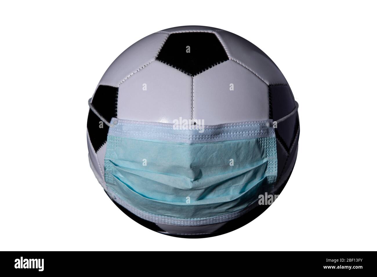 soccer ball wearing a mask, concept of sports suffering from the COVID ...