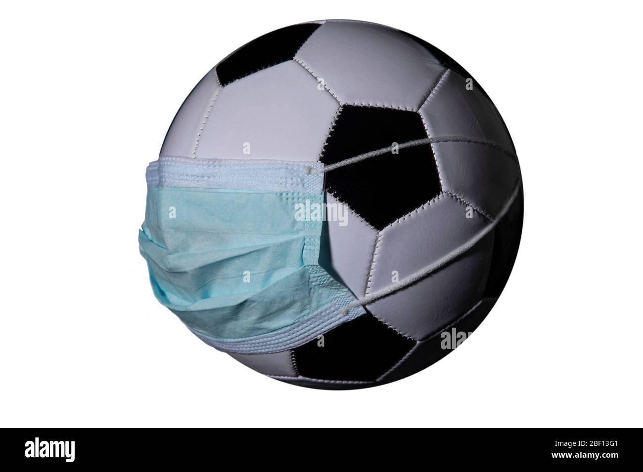 soccer ball wearing a mask, concept of sports suffering from the COVID ...