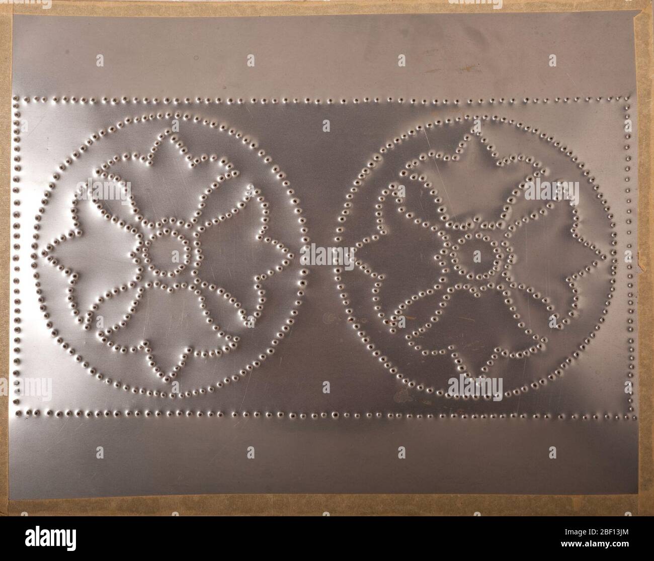 Tin Punch Design with Two Circles Stock Photo - Alamy