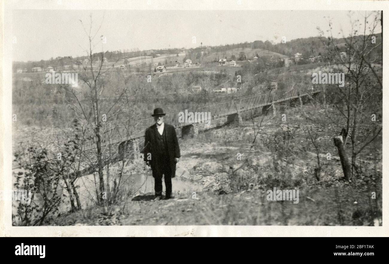 Chain Bridge. Background shows a view of the Palisades, Washington, D.C ...