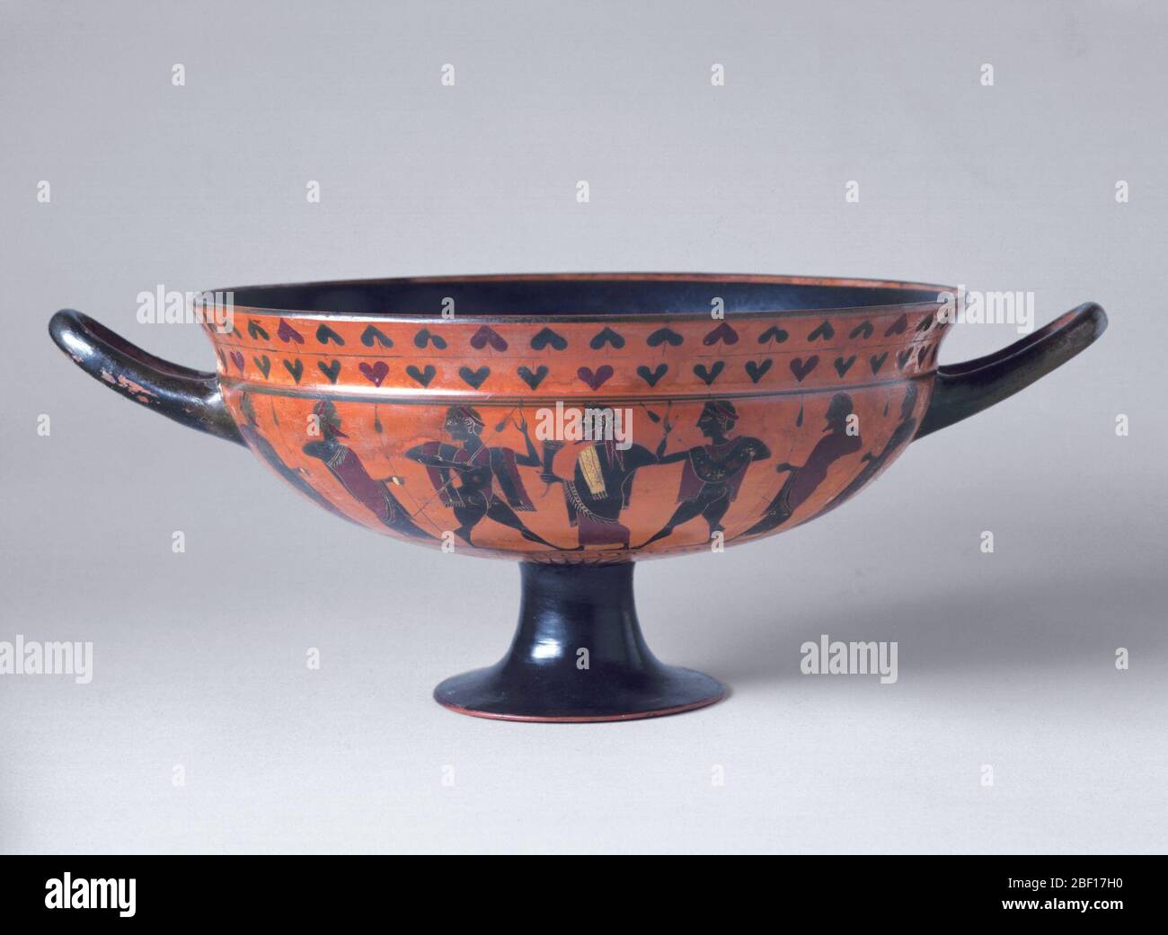 Kylix. Wide shallow bowl on flaring foot, two loop handles oriented ...