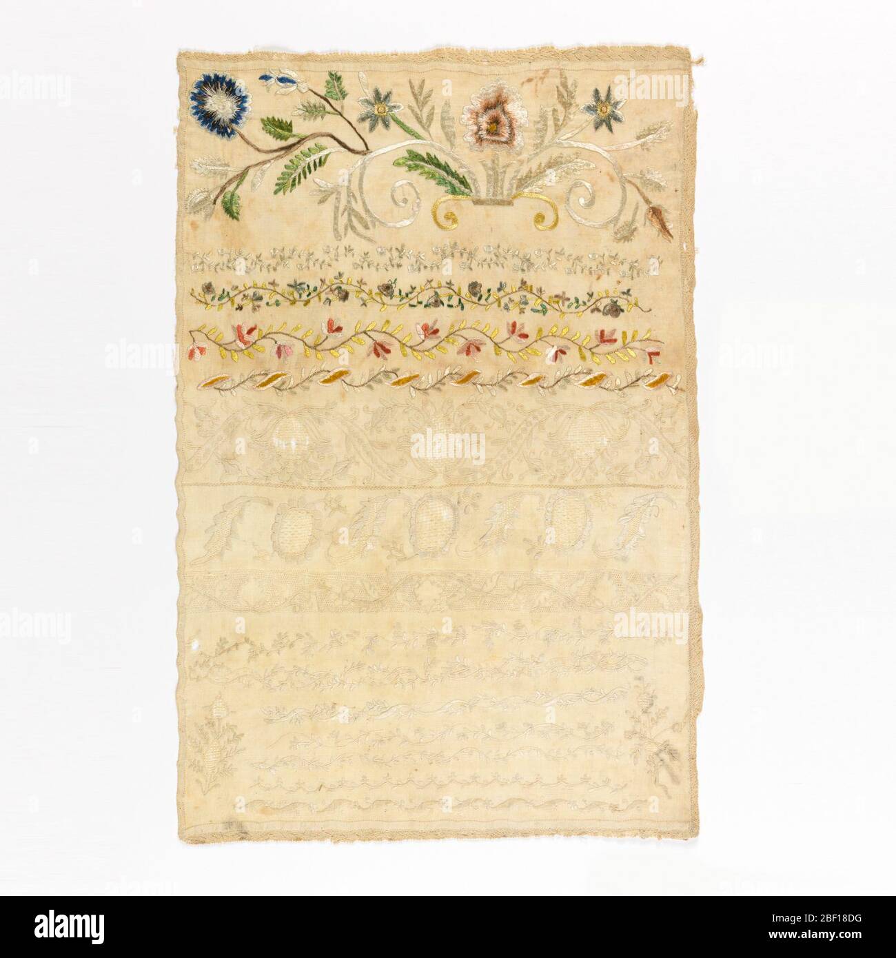 Sampler. Flowers growing out of a scroll with cross borders in floral ...