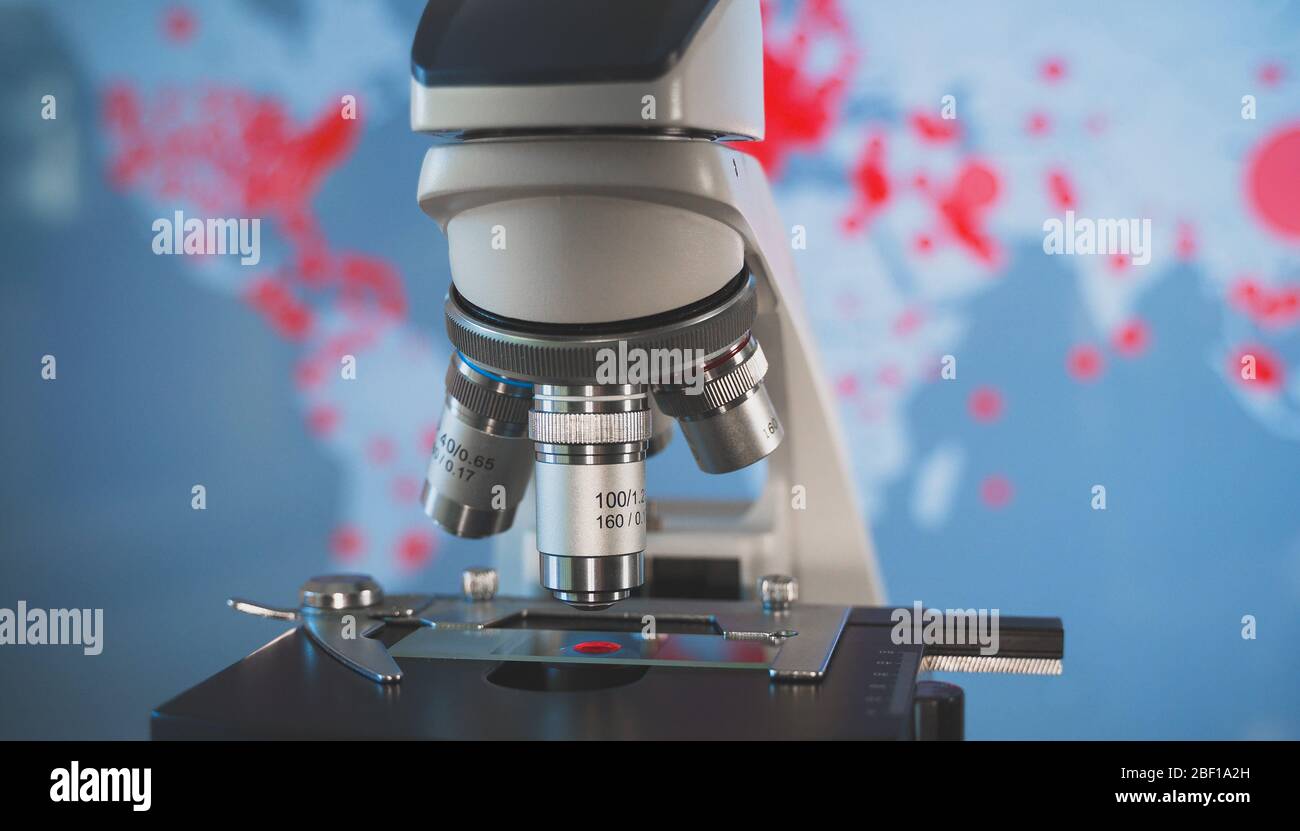 Laboratory microscope with blood sample. Coronavirus map infection on ...
