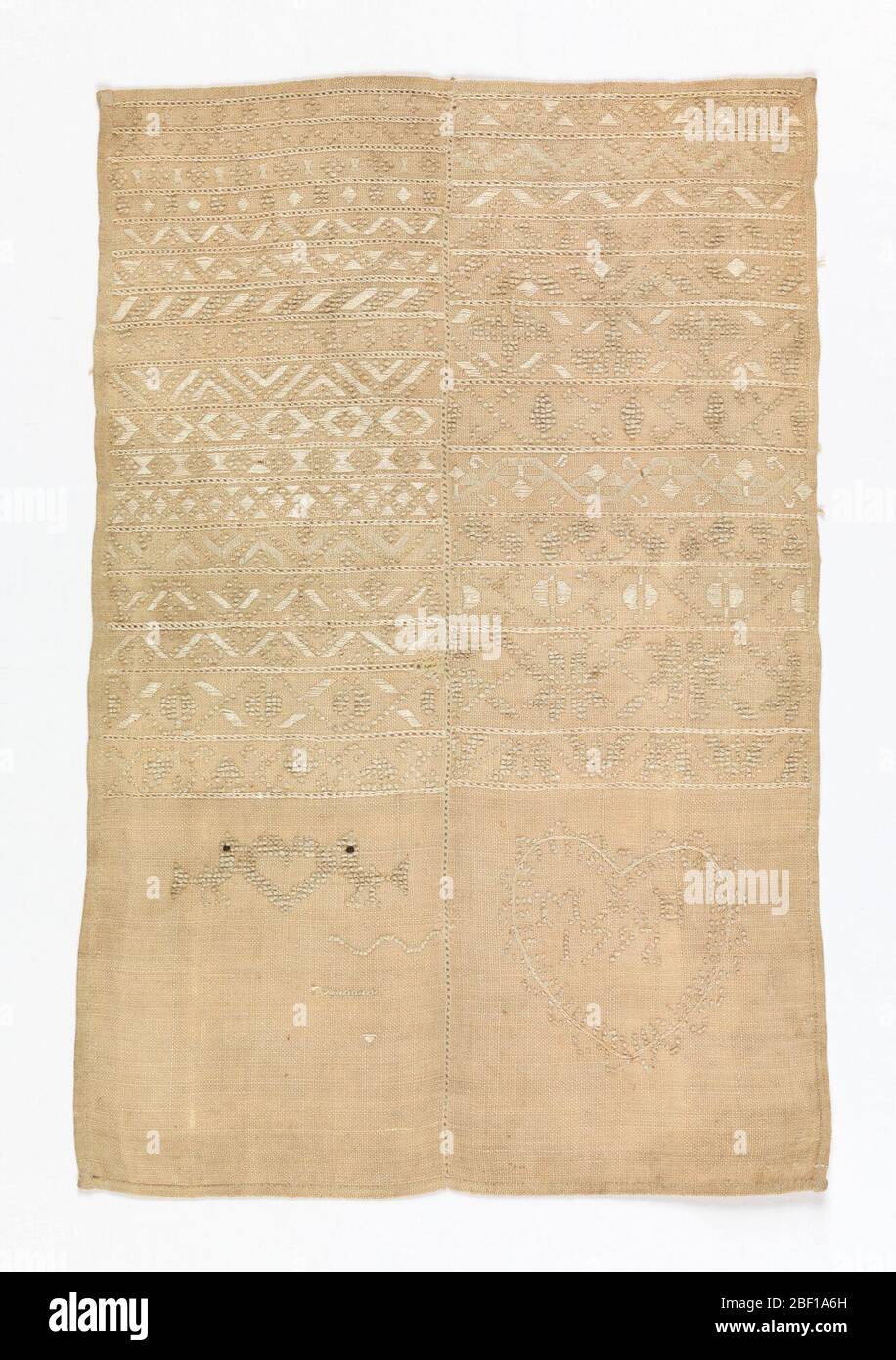 Sampler. Vertical rectangle of white linen divided into two colums by a ...