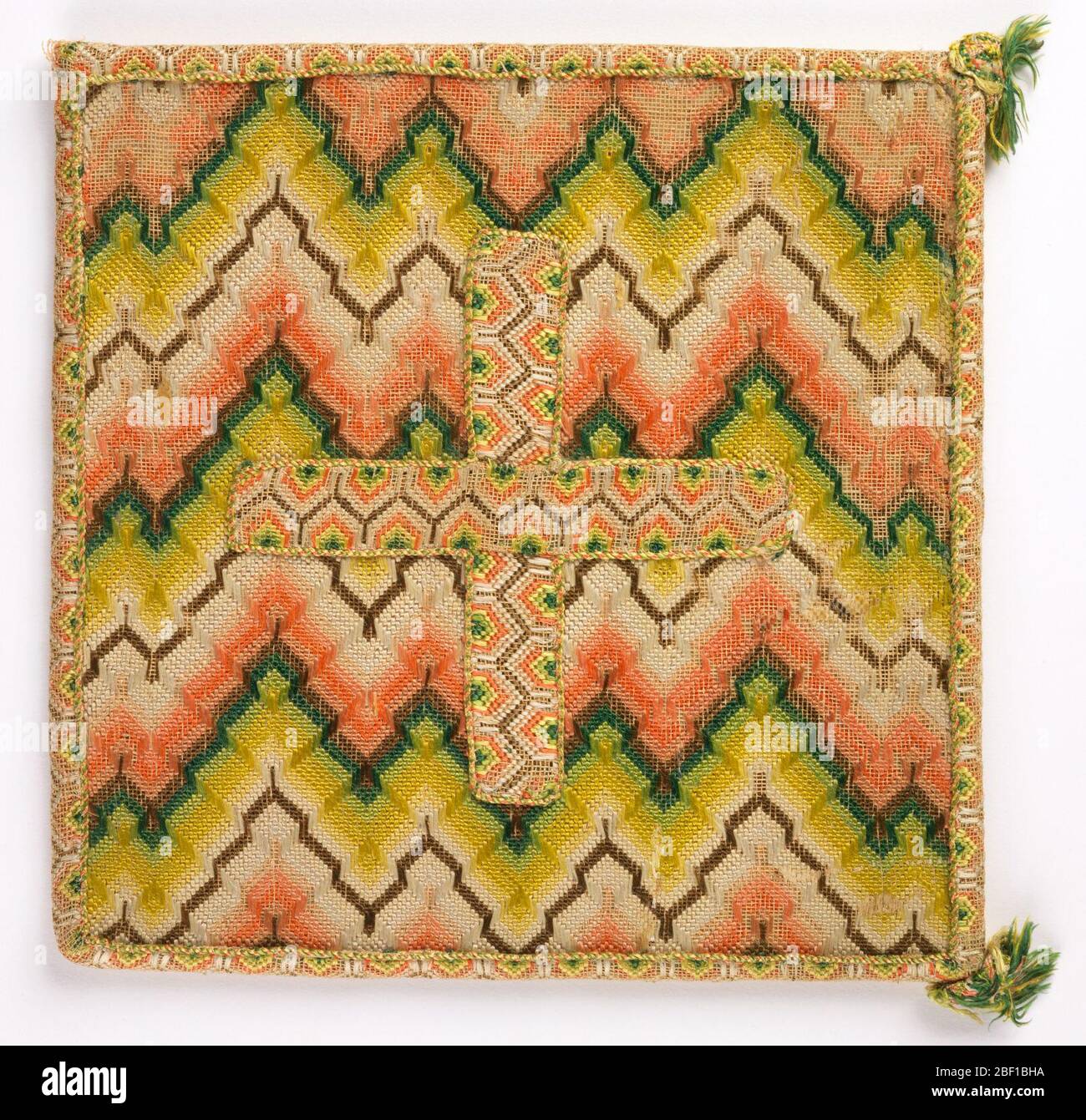 Burse. Zigzag pattern of white, pinks and greens, with a cross of a ...