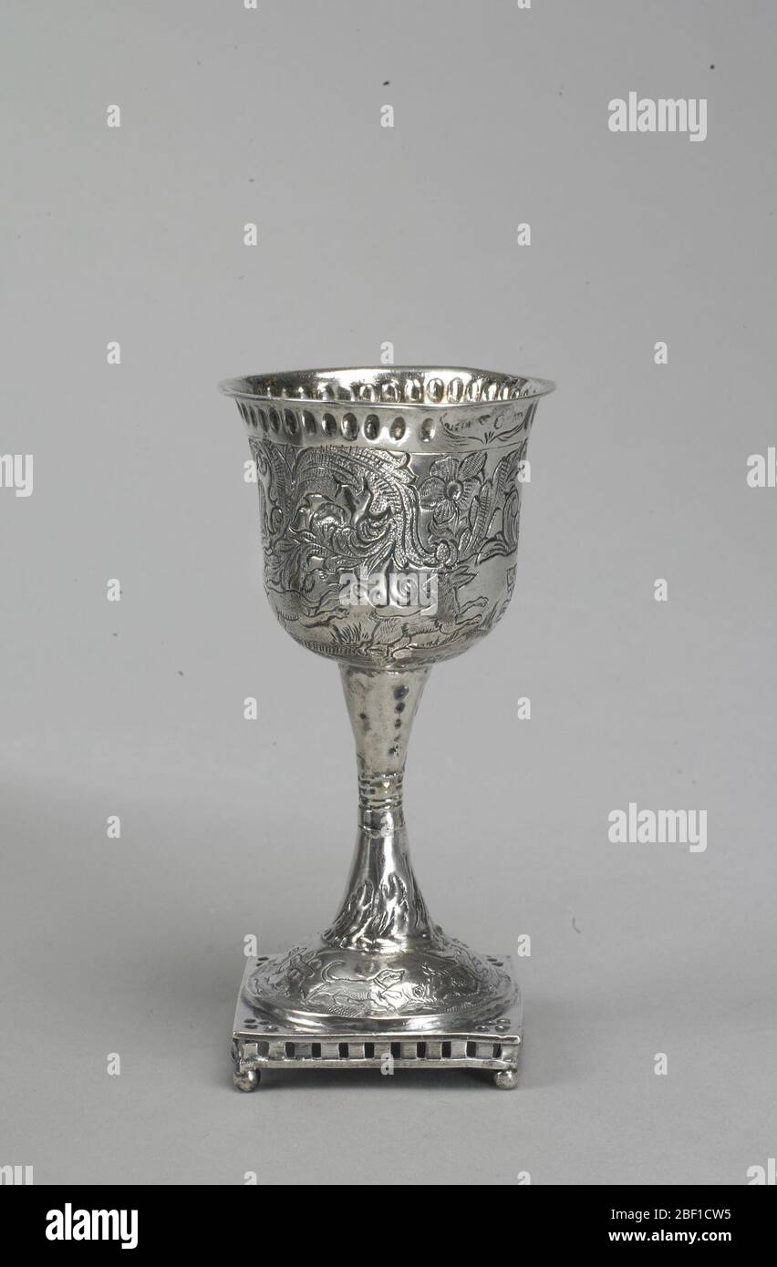 Standing cup. Square openwork base on four ball feet. Domed foot ...