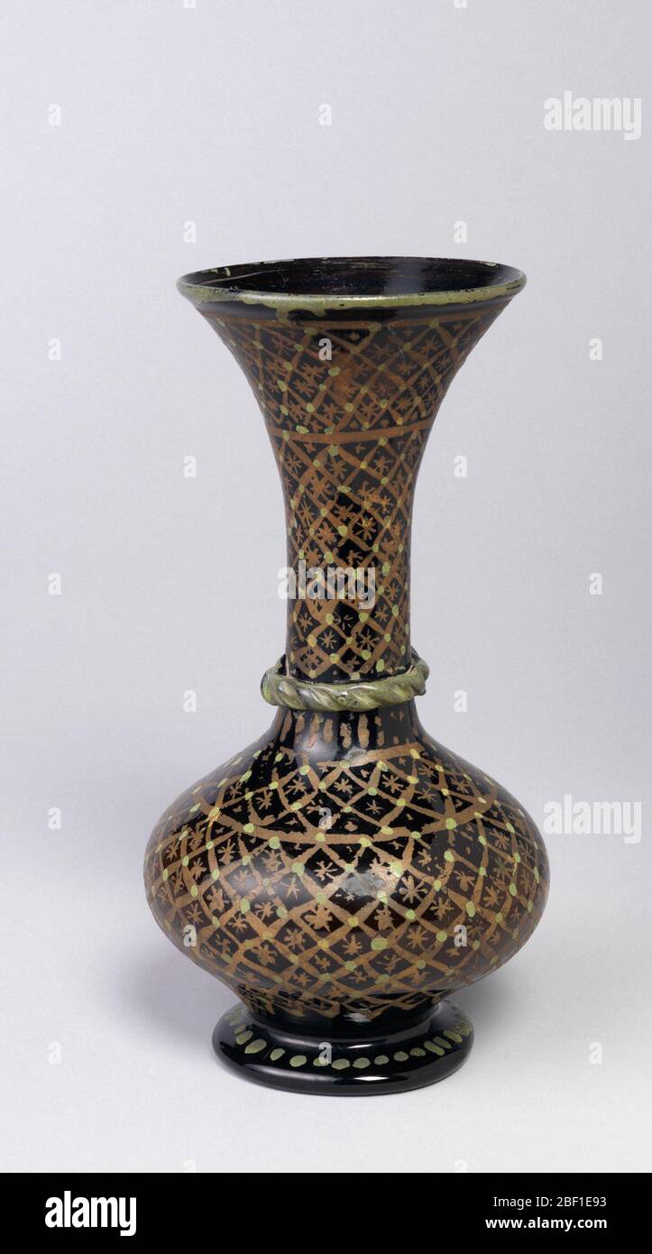 Vase. Oblate body, receding foot. Tall cylindrical neck with broad ...