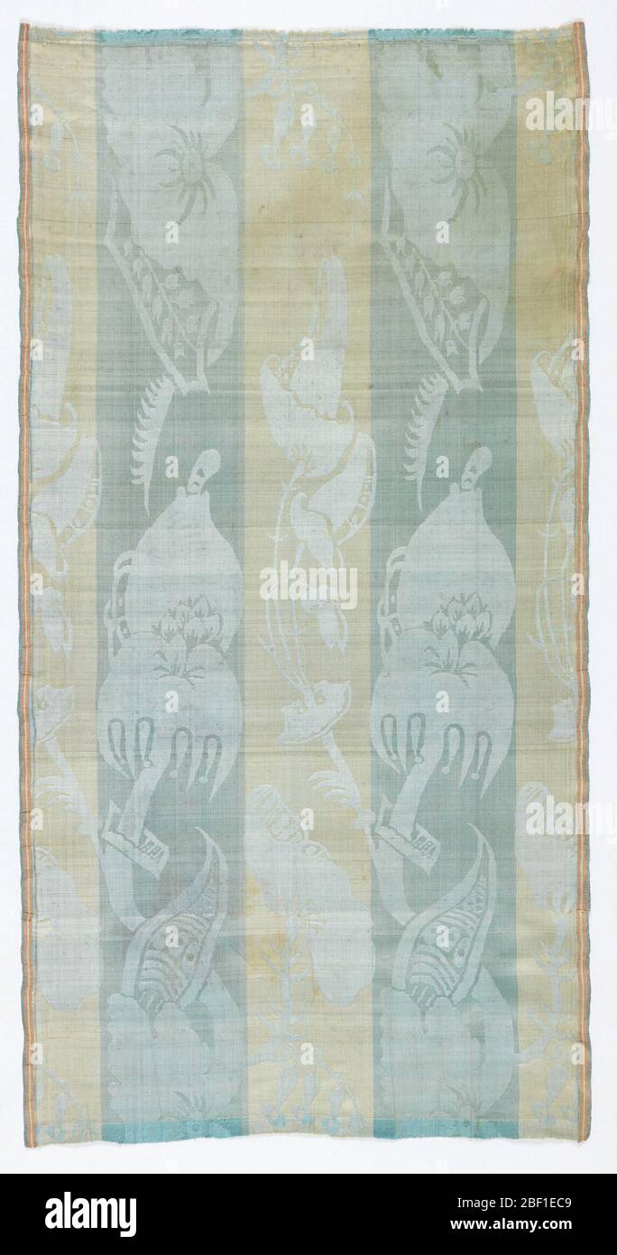 Textile. Pale blue damask in a design of large, loosely drawn and ...