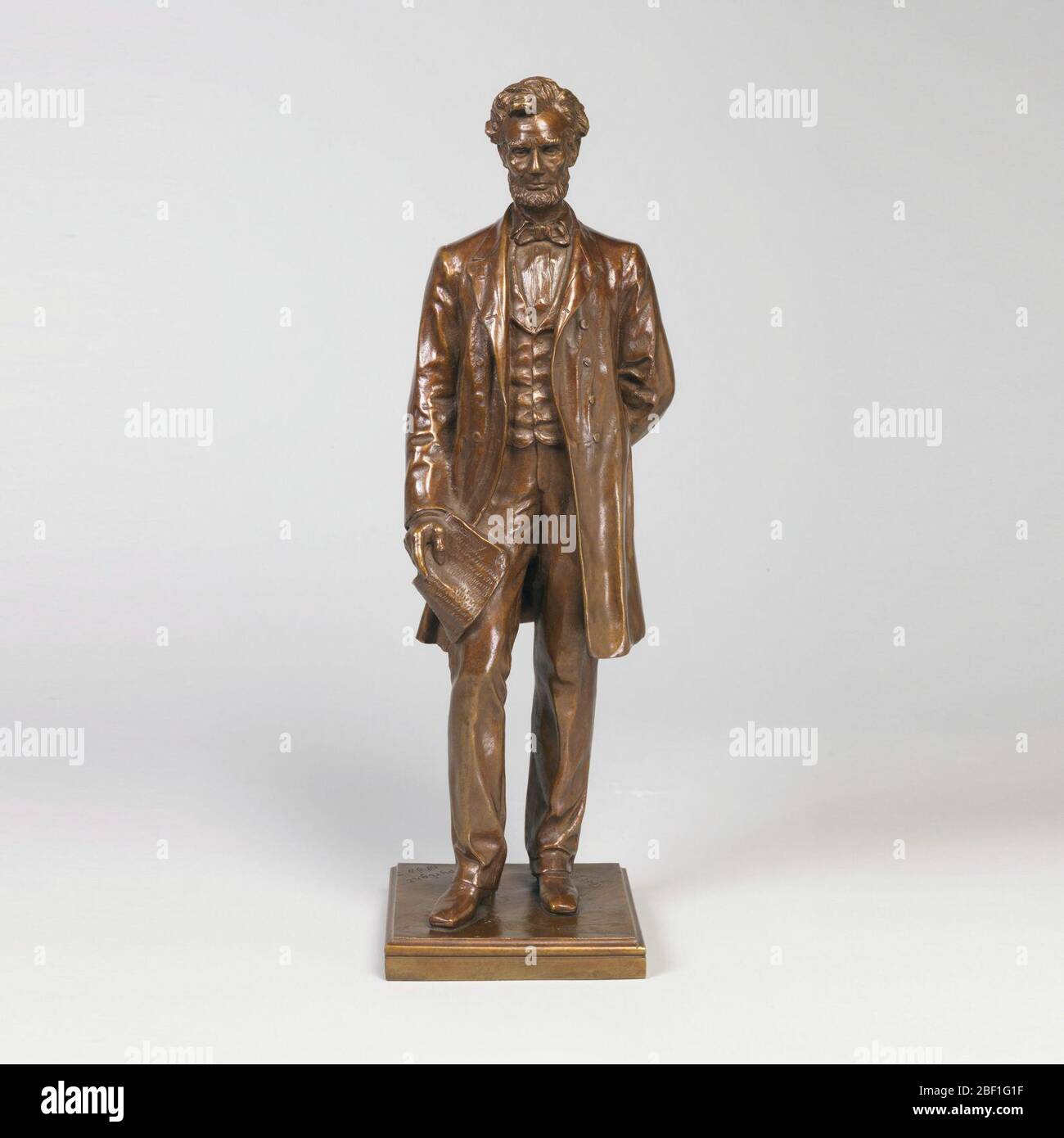 Abraham Lincoln. Figure of Abraham Lincoln standing upright holding a ...